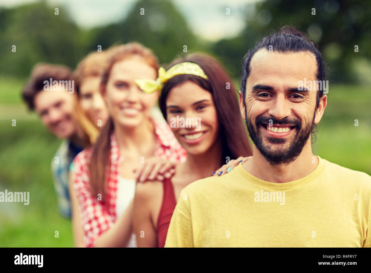 group of smiling friends outdoors Stock Photo - Alamy