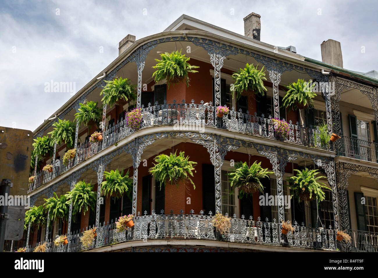 A corner building with balconies and wrought iron railings. A classic ...