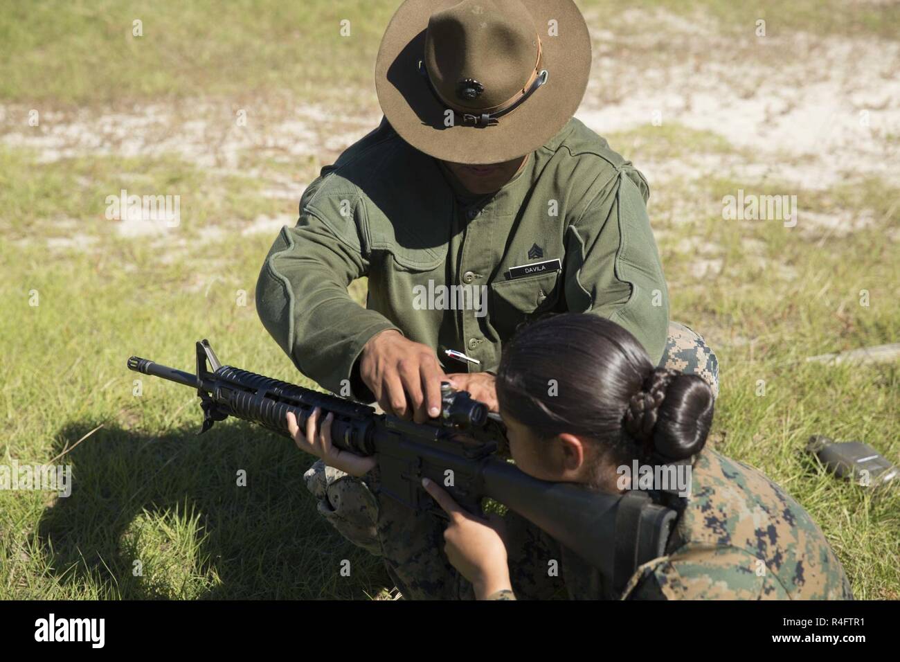 U.S. Marine Corps Sgt. Miguel Davila, primary marksmanship instructor ...