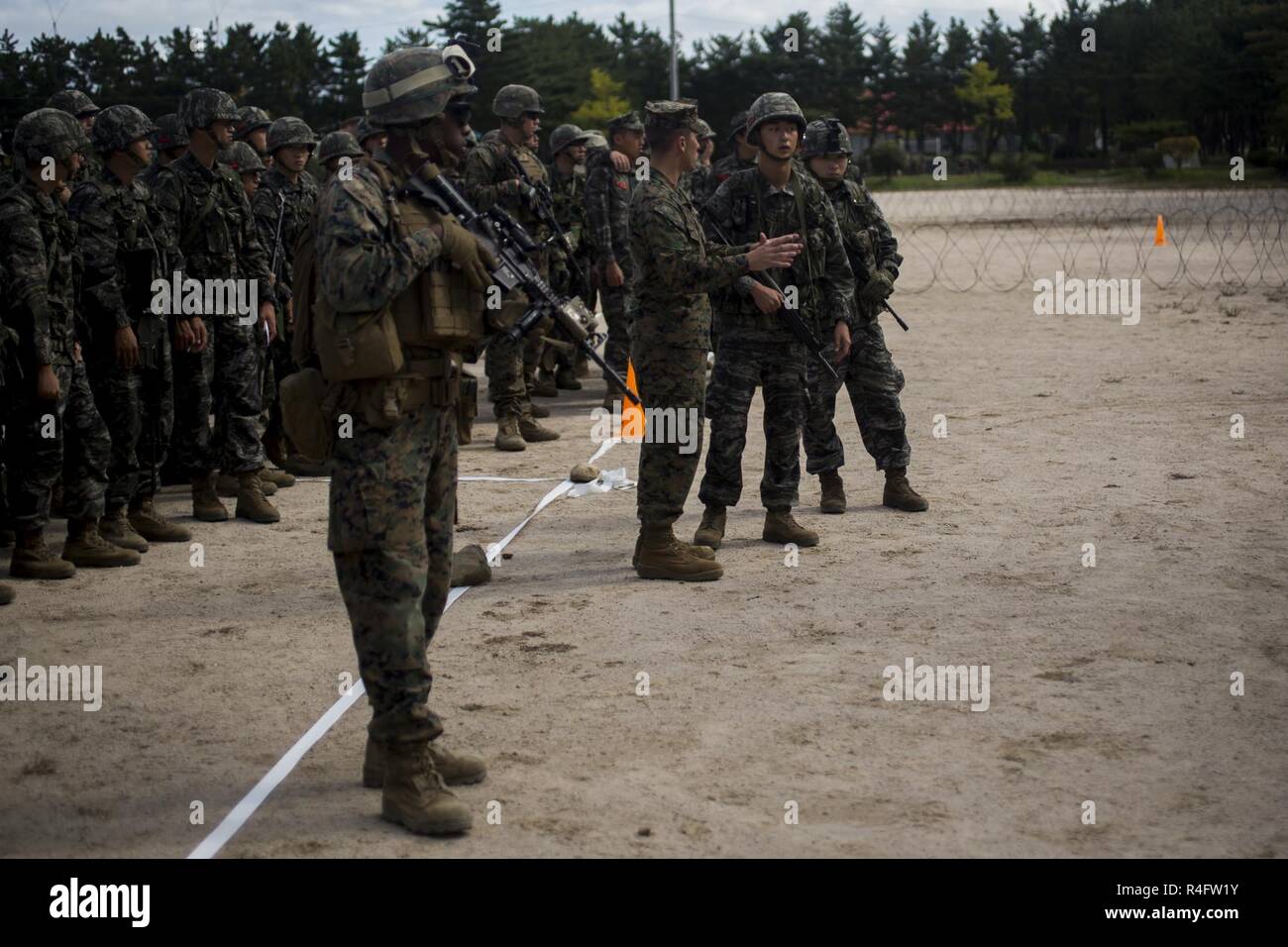 U.S. Marines with Lima Company, 3rd Battalion 2nd Marines, instruct ...