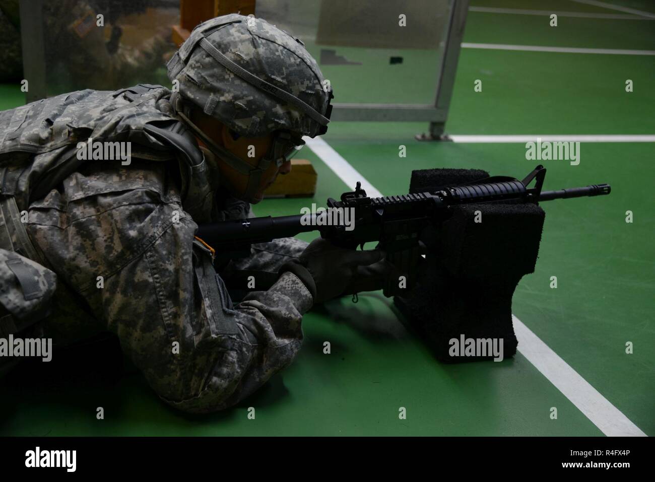 U.S. Army Spc. Gabriel Perez, assigned to 39th Signal Battalion, loads ...