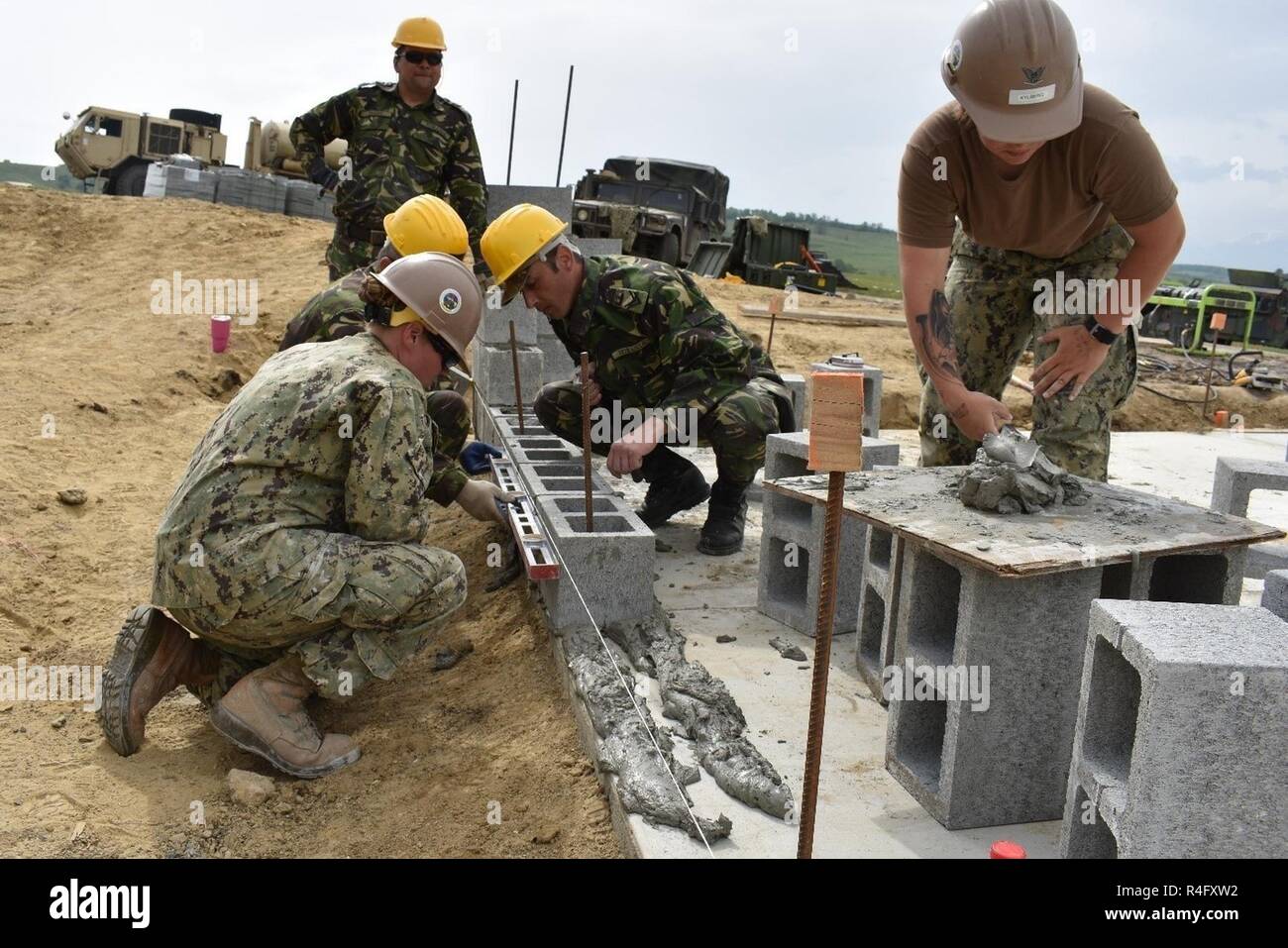 Builder 3rd Class Alexis Franklin works with Corporals Giurca, Szabo ...