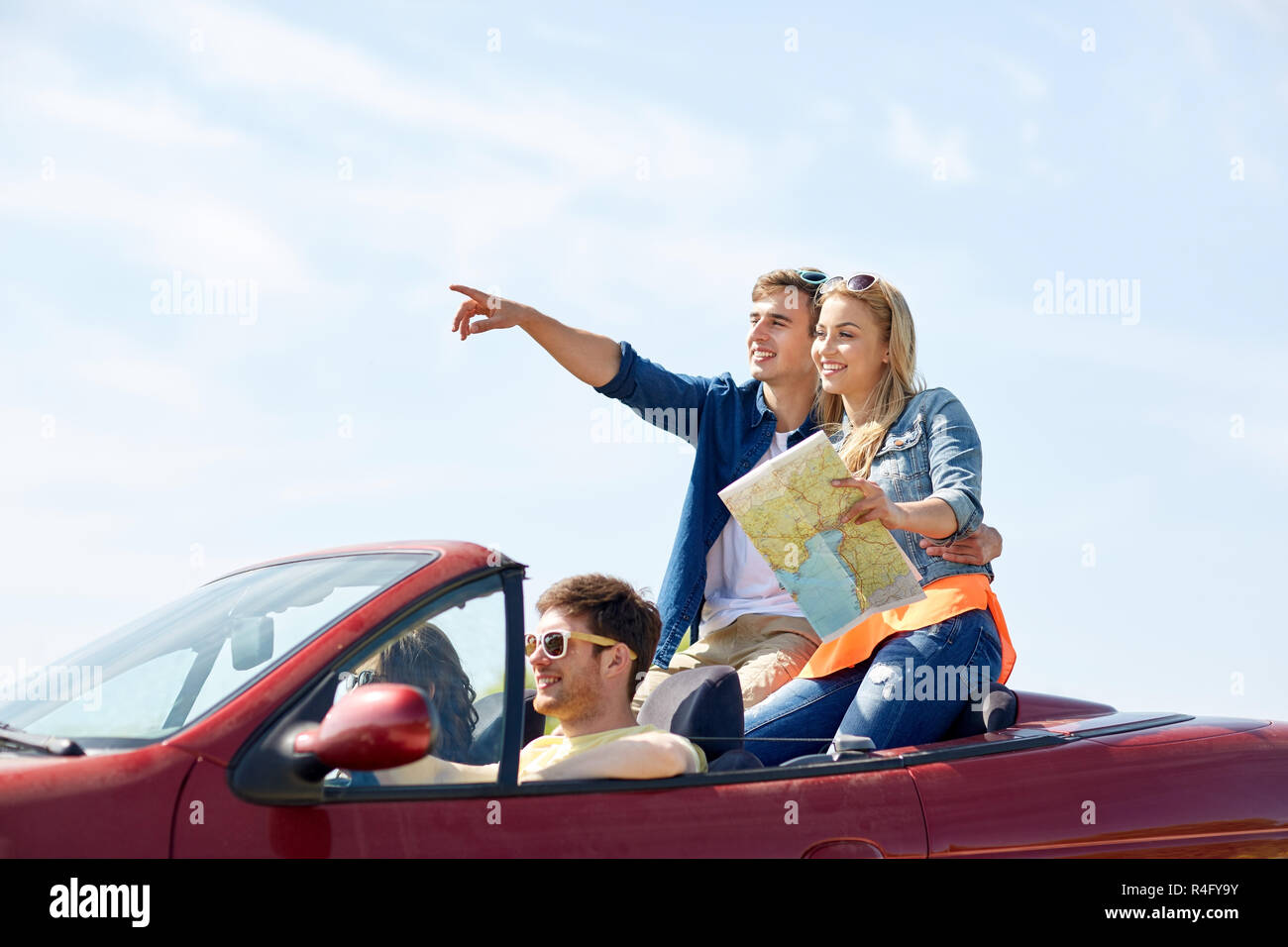 happy friends driving in cabriolet car Stock Photo - Alamy