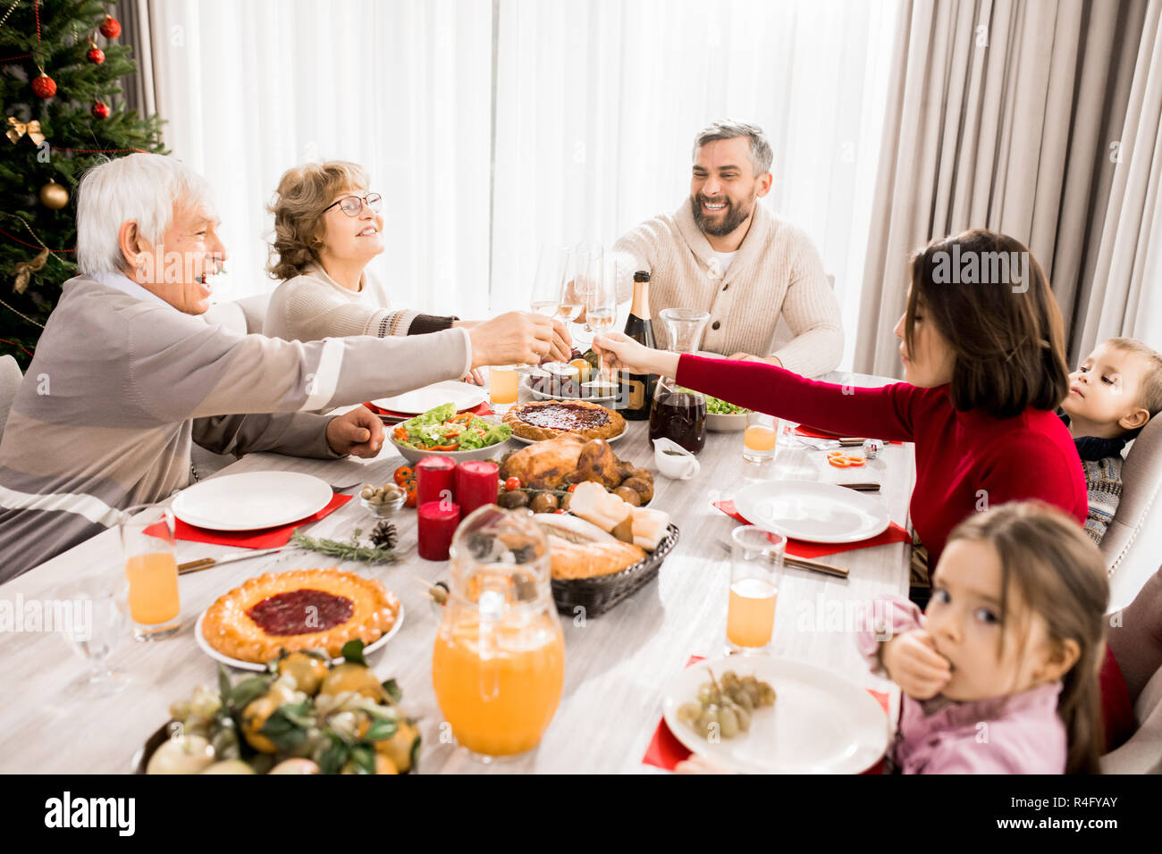 Family Enjoying Christmas Feast Stock Photo - Alamy