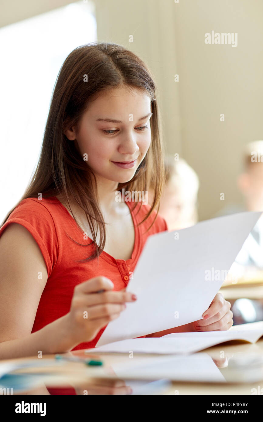 happy student girl with test paper at school Stock Photo - Alamy