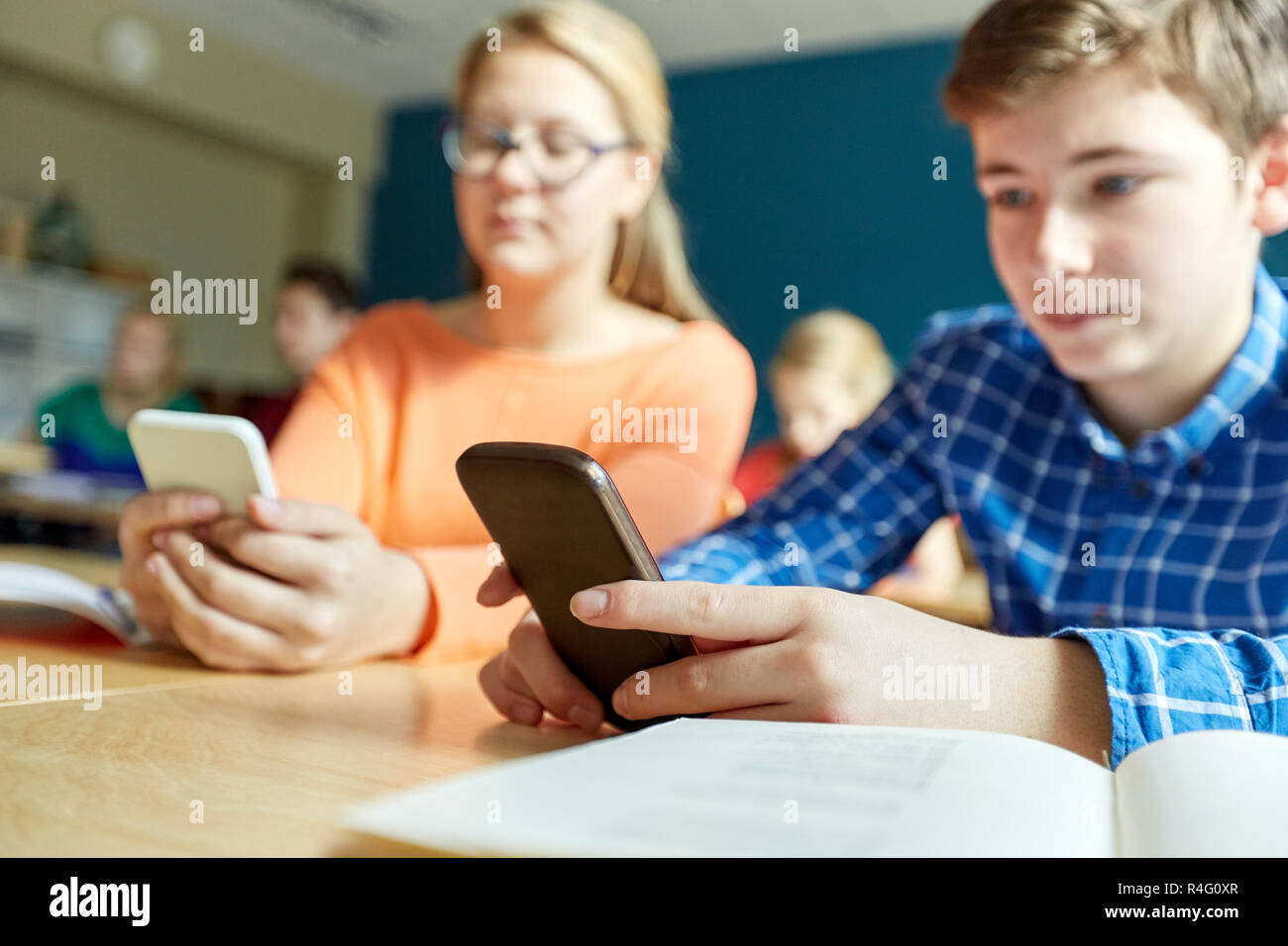 Group high school students texting hi-res stock photography and images ...