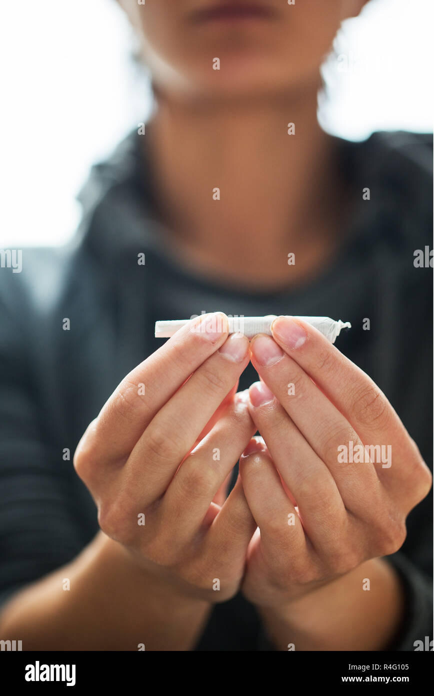 Woman smoking roll up cigarette hi-res stock photography and images - Alamy