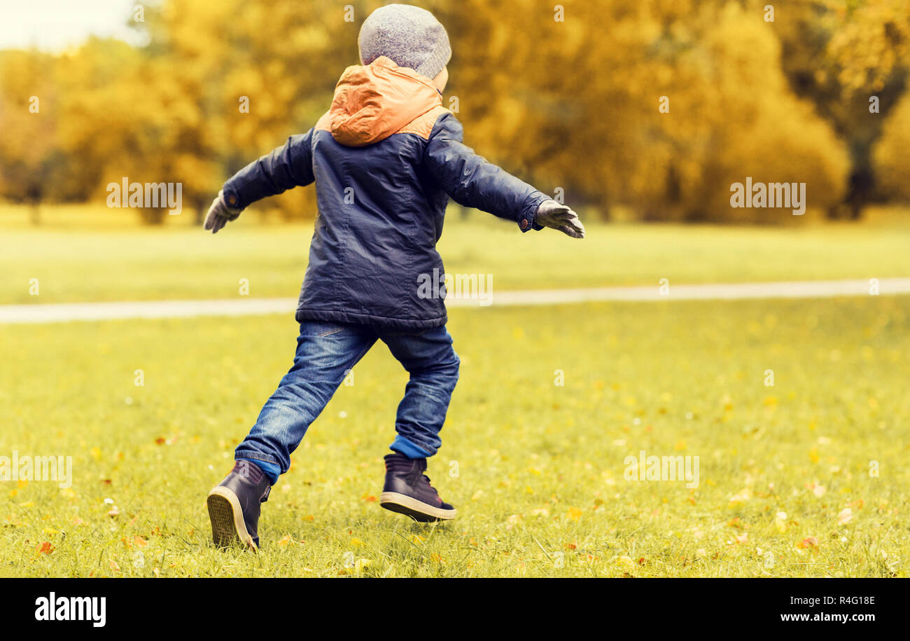 Child running looking back rear view hi-res stock photography and ...