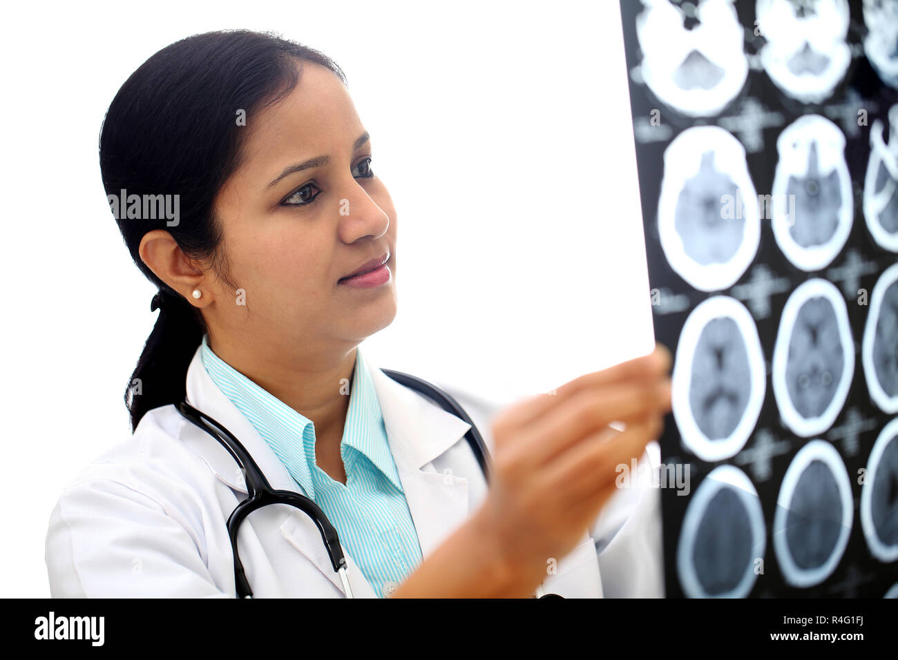 Female doctor examining a brain computerized tomography scan Stock ...