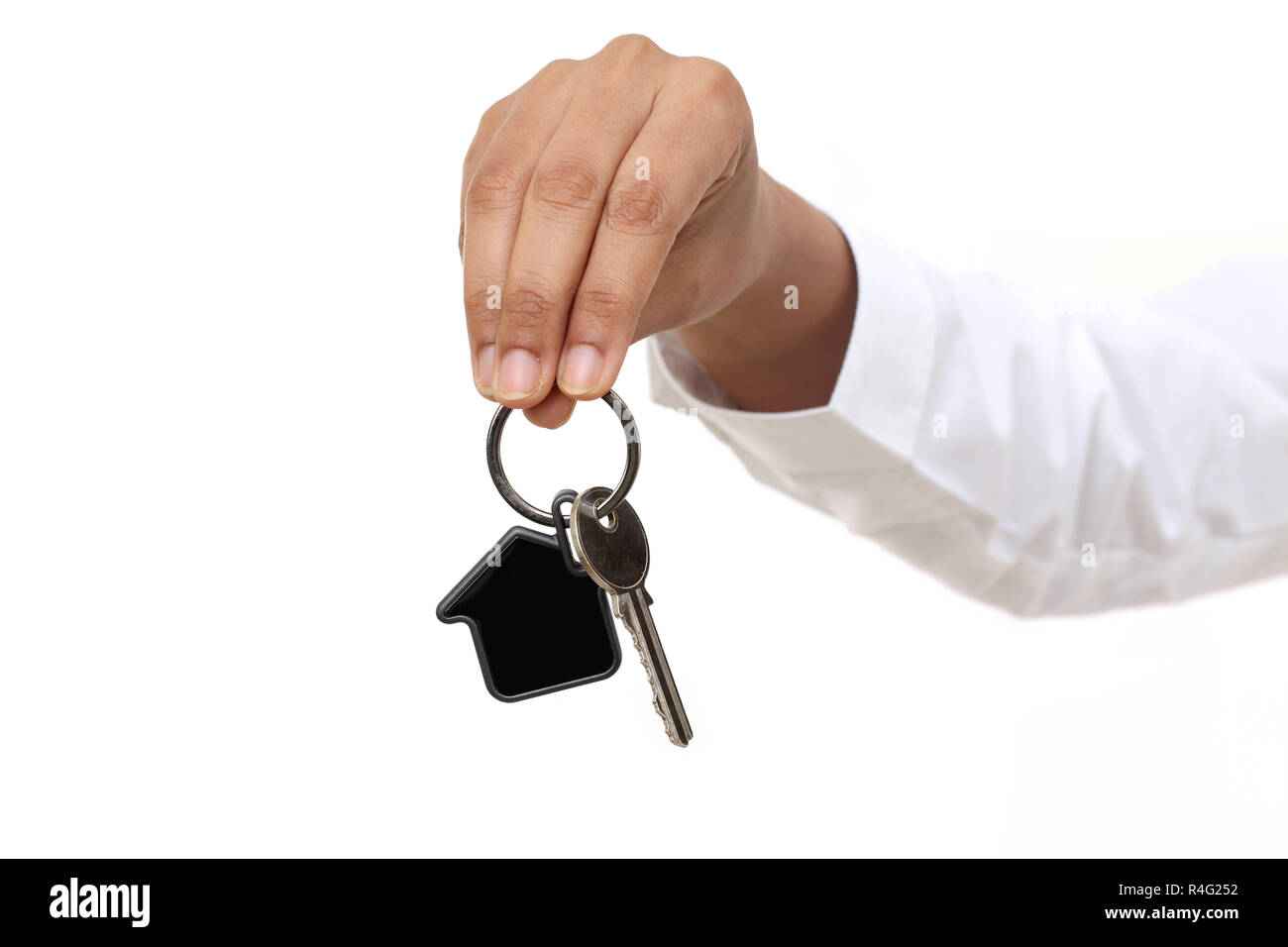 Real estate agent giving house keys to the owner Stock Photo - Alamy