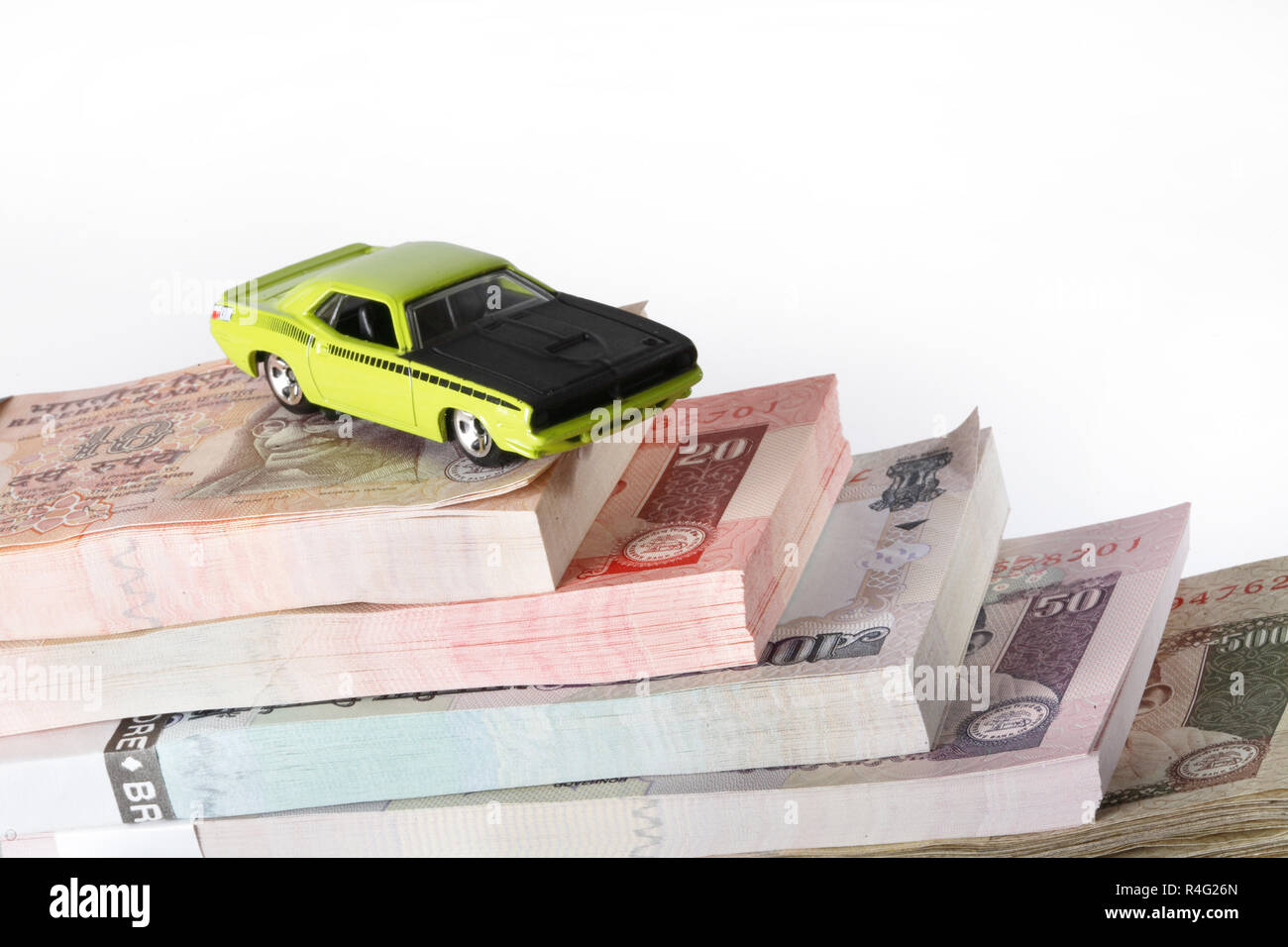 Car on money stack Stock Photo - Alamy