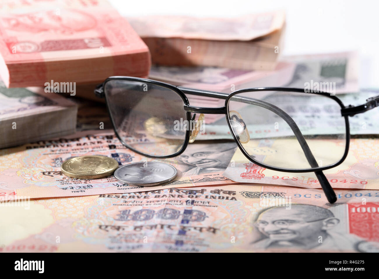 Indian money with spectacles Stock Photo - Alamy
