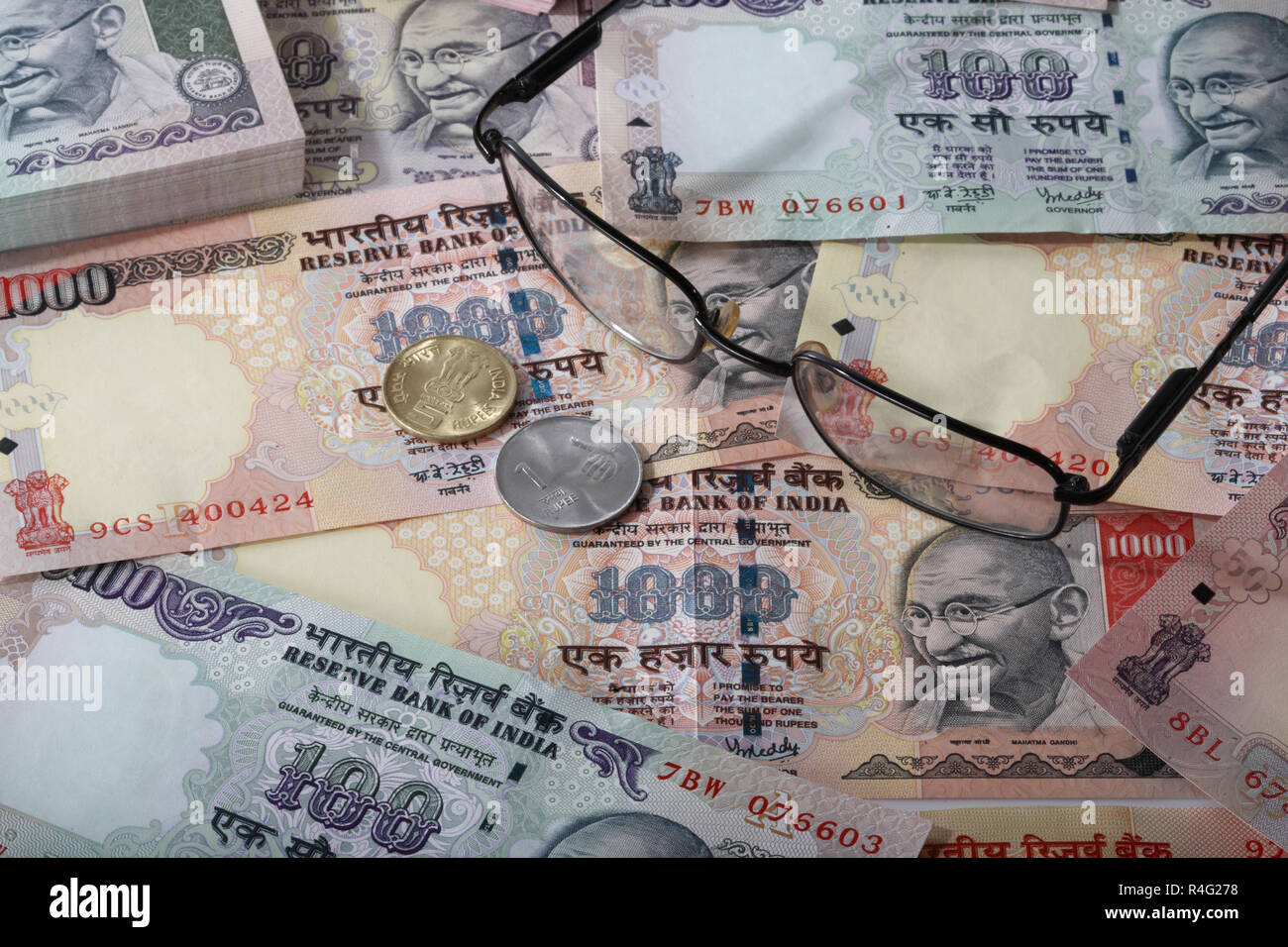 Indian money with spectacles Stock Photo - Alamy