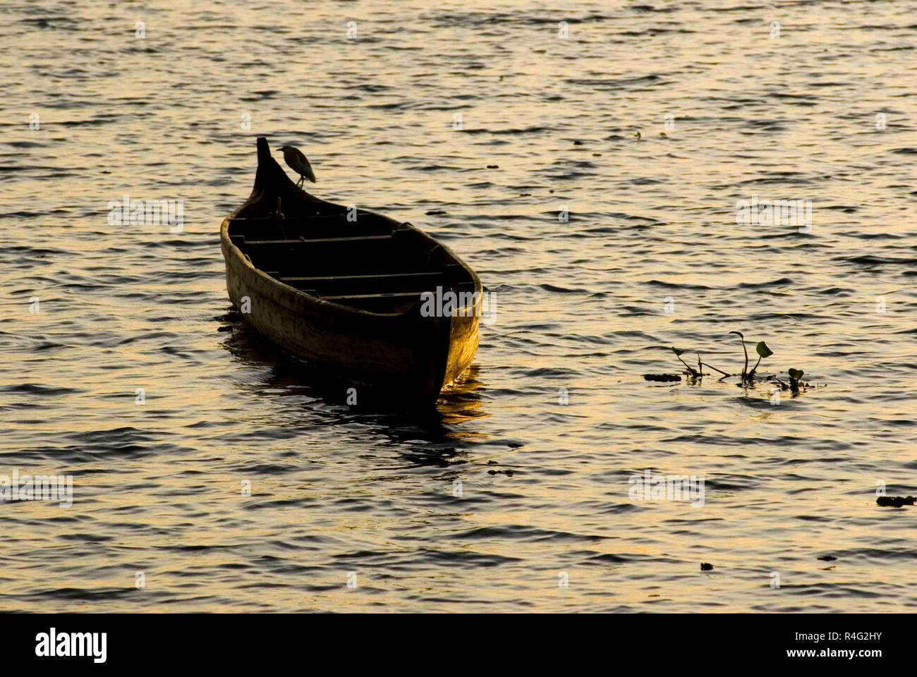 Boat floating on water Stock Photo - Alamy