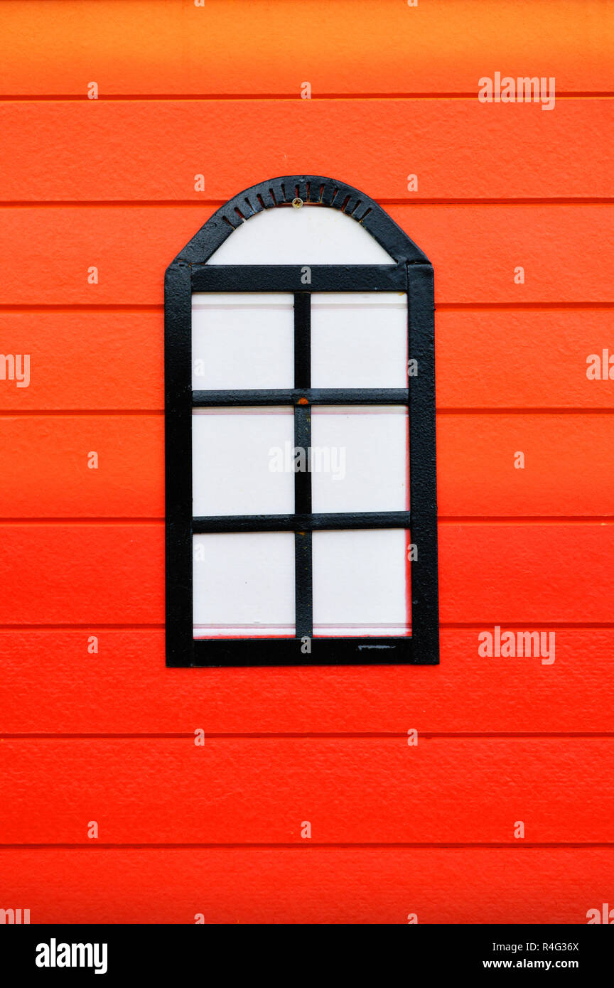 red wall background with window on wood wall red and orange background ...