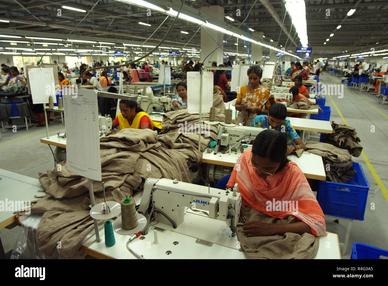 Women sewing clothes Stock Photo - Alamy
