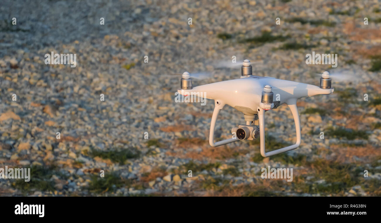The drone, hovering above the ground Stock Photo - Alamy