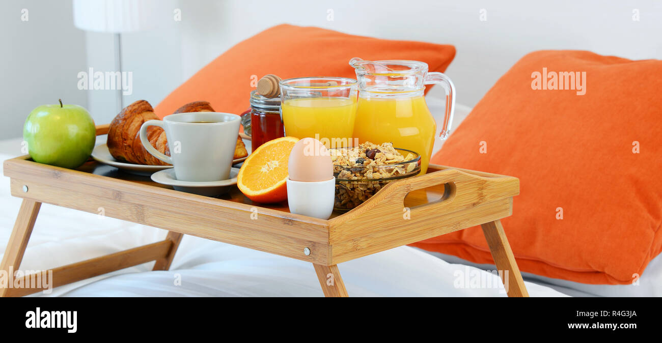 Breakfast in bed in hotel room Stock Photo - Alamy