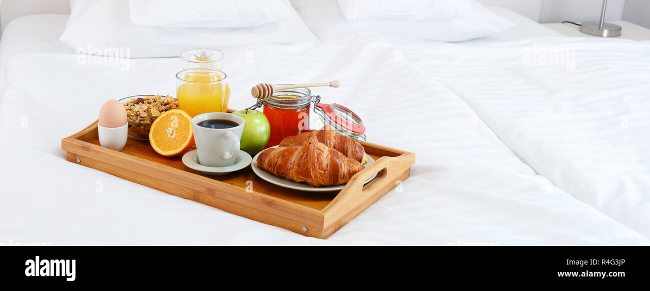Breakfast in bed in hotel room Stock Photo - Alamy