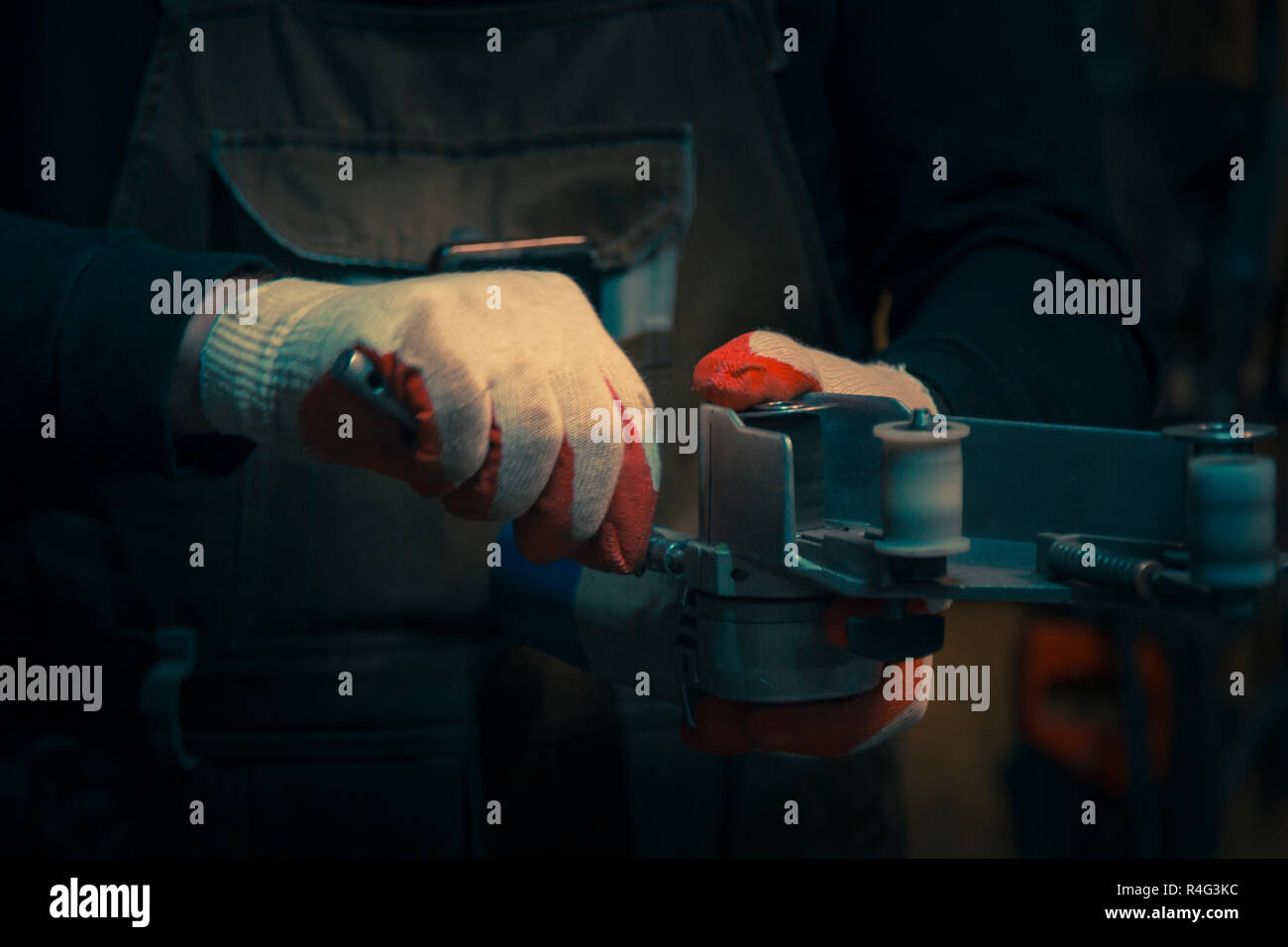 Master hands in gloves hi-res stock photography and images - Alamy