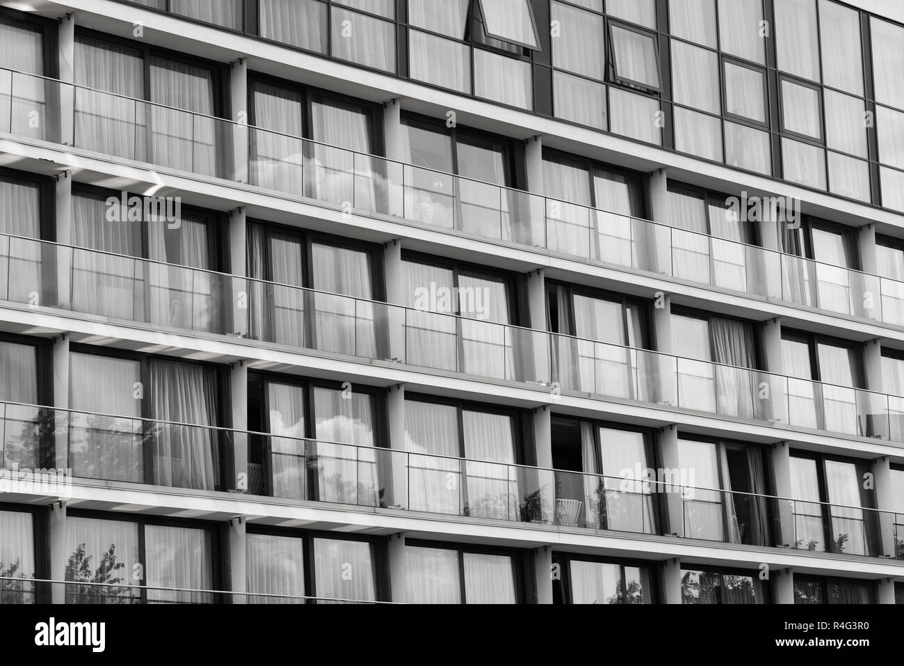 Glass facade - many glazed balconies, black & white Stock Photo - Alamy