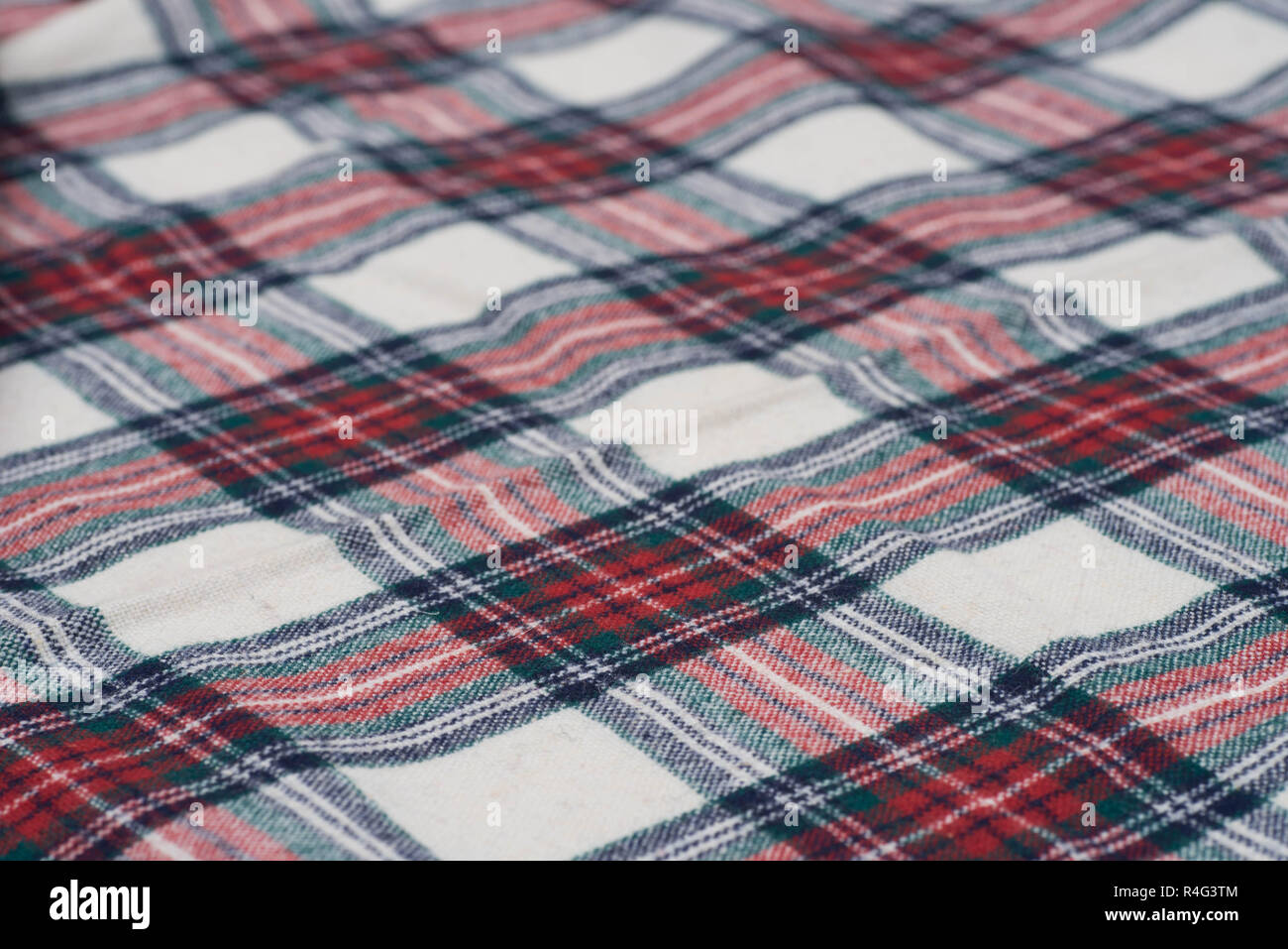 folded creased multicolored checkered woolen fabric background texturr ...