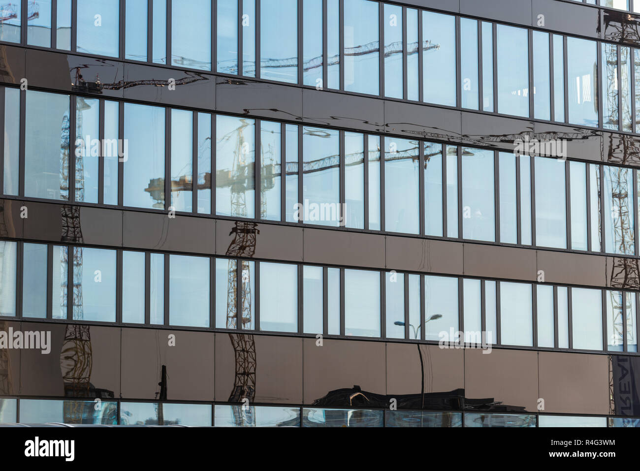 mirror effect on the facade of the office building Stock Photo - Alamy