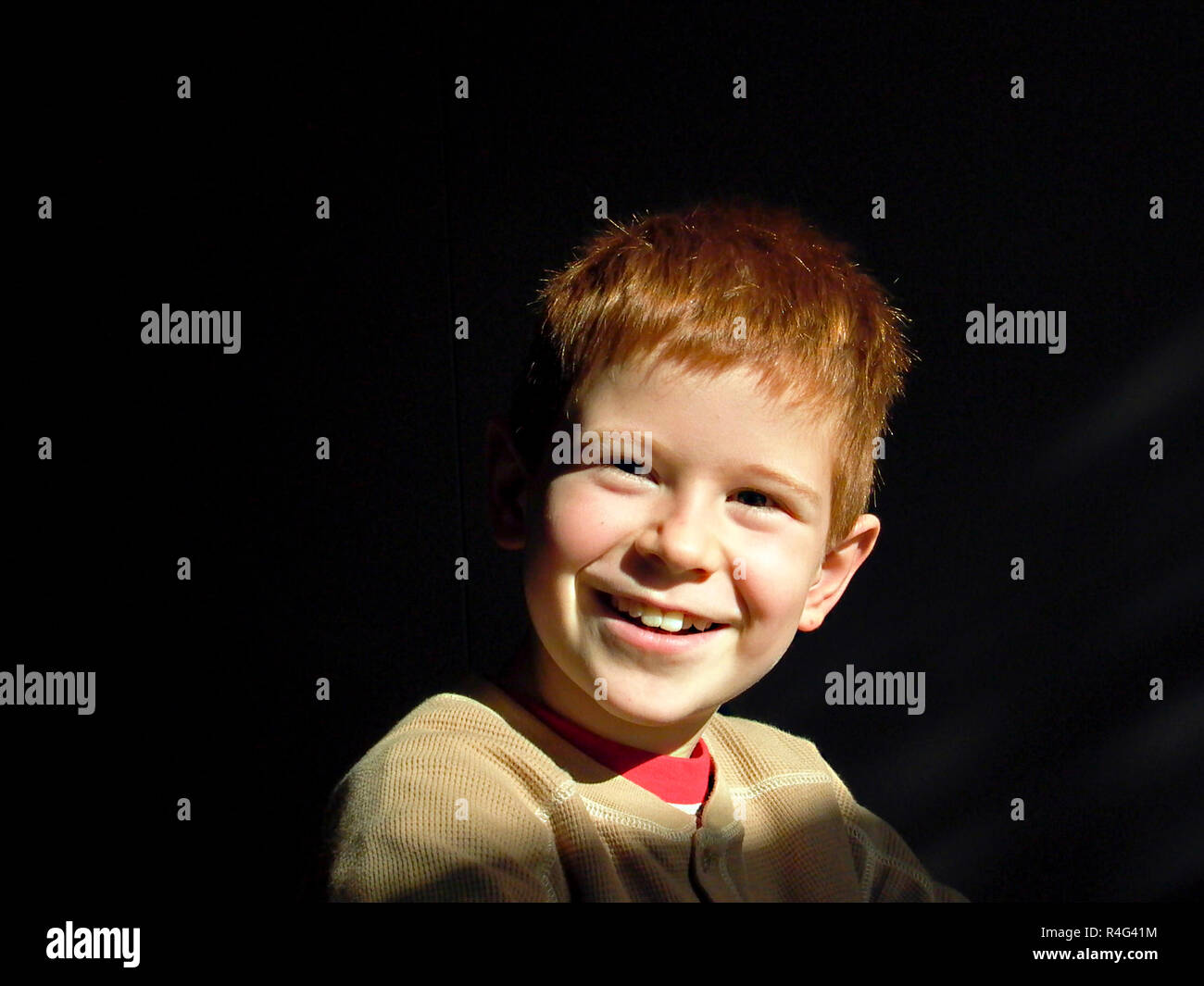 cute boy with black background Stock Photo - Alamy