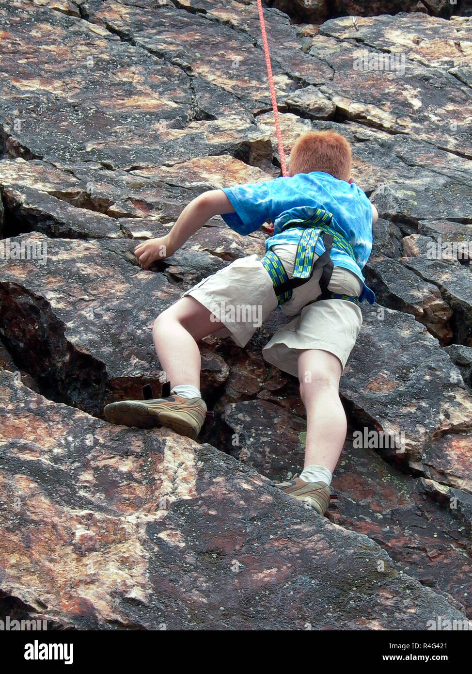 boy climbing on rope Stock Photo - Alamy