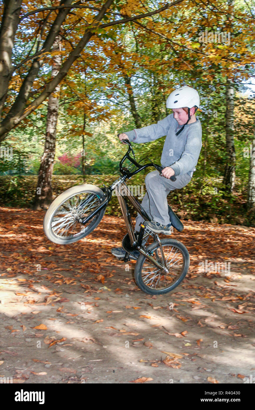 child jumping with the Bike at a ramp Stock Photo - Alamy