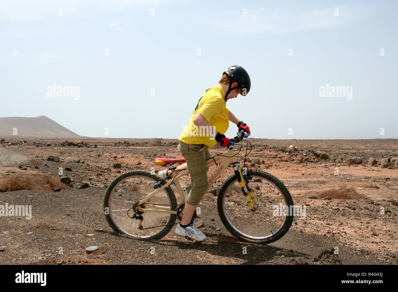 boy riding his mountainbike offroads and doing tricks Stock Photo - Alamy