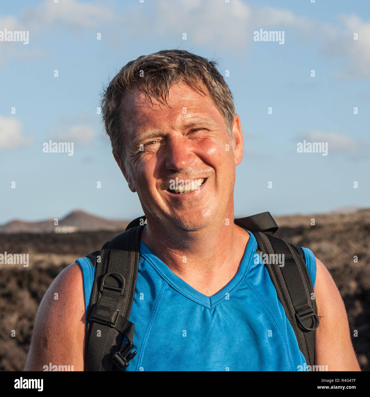 man on walking trail in volcanic area Stock Photo - Alamy