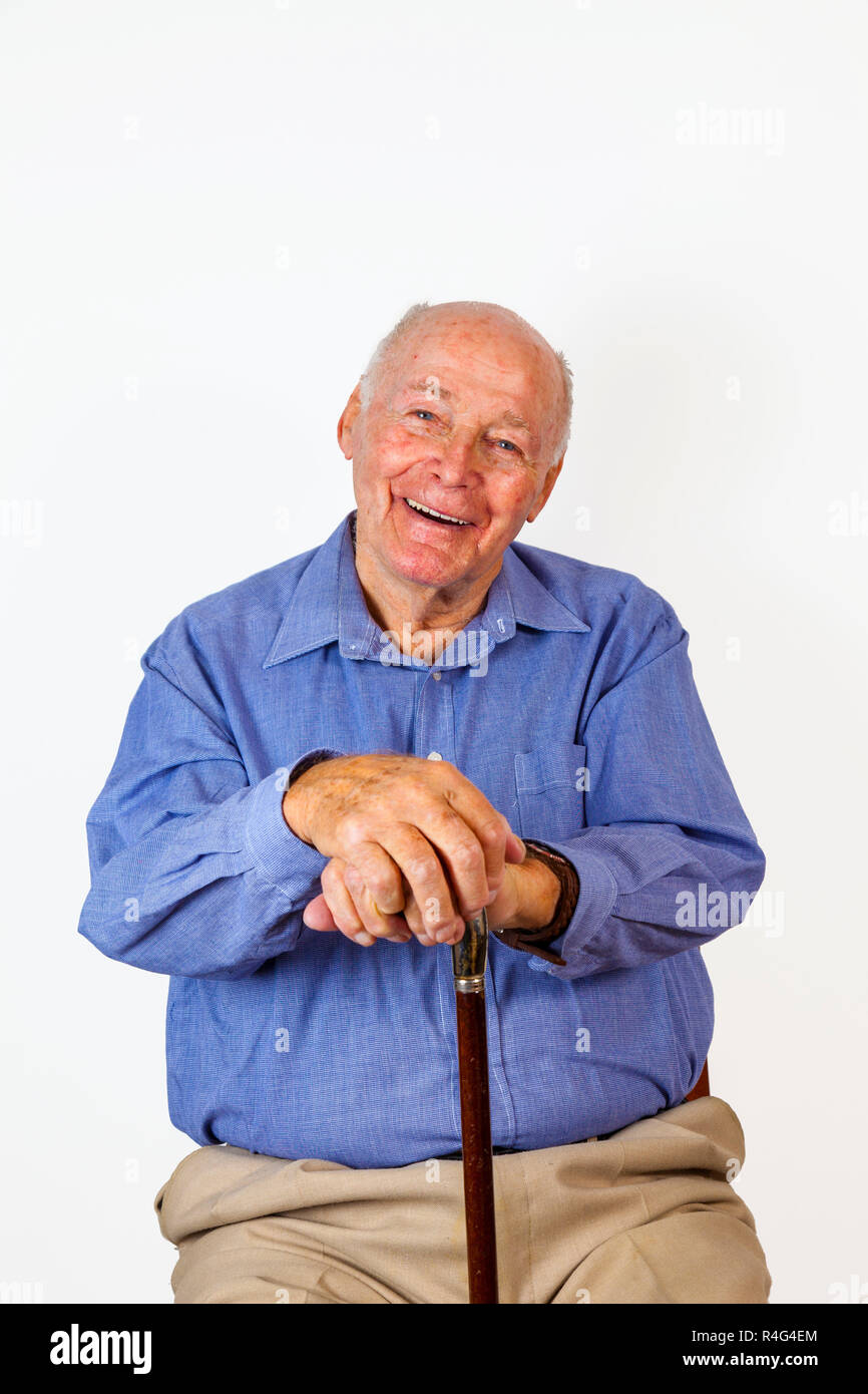 happy elderly man sitting in a chair Stock Photo - Alamy