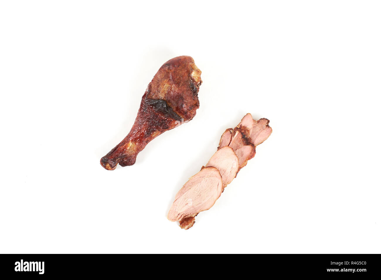 roast turkey leg and sliced turkey meat isolated on white background ...