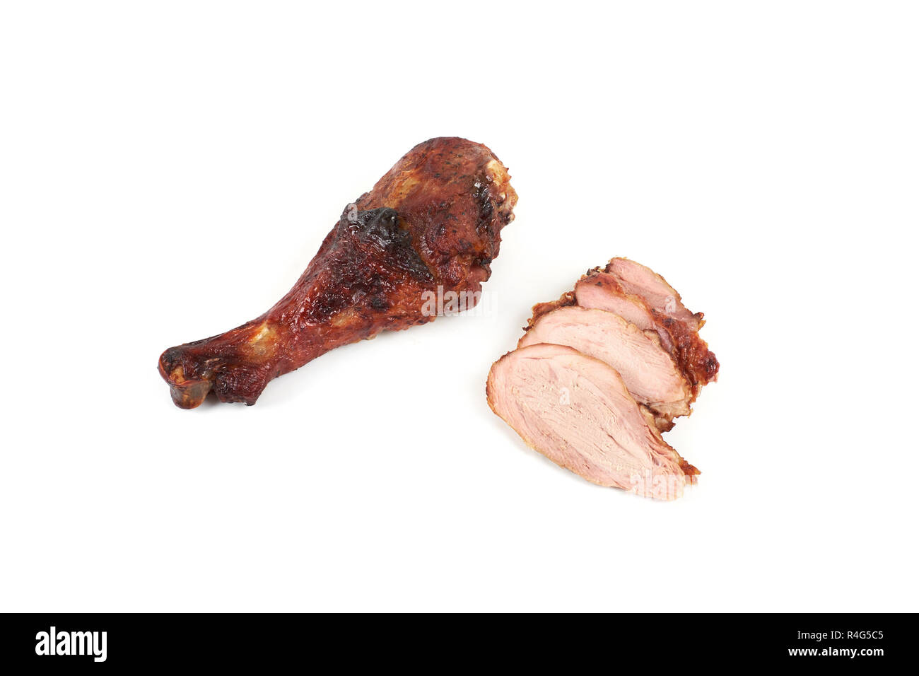 roast turkey leg and sliced turkey meat isolated on white background ...