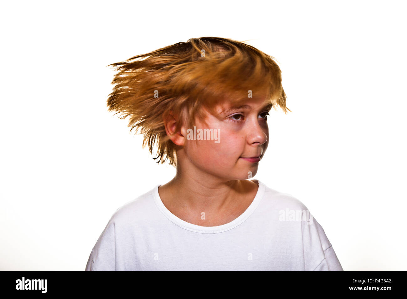 boy is moving his head and hairs are flying Stock Photo - Alamy