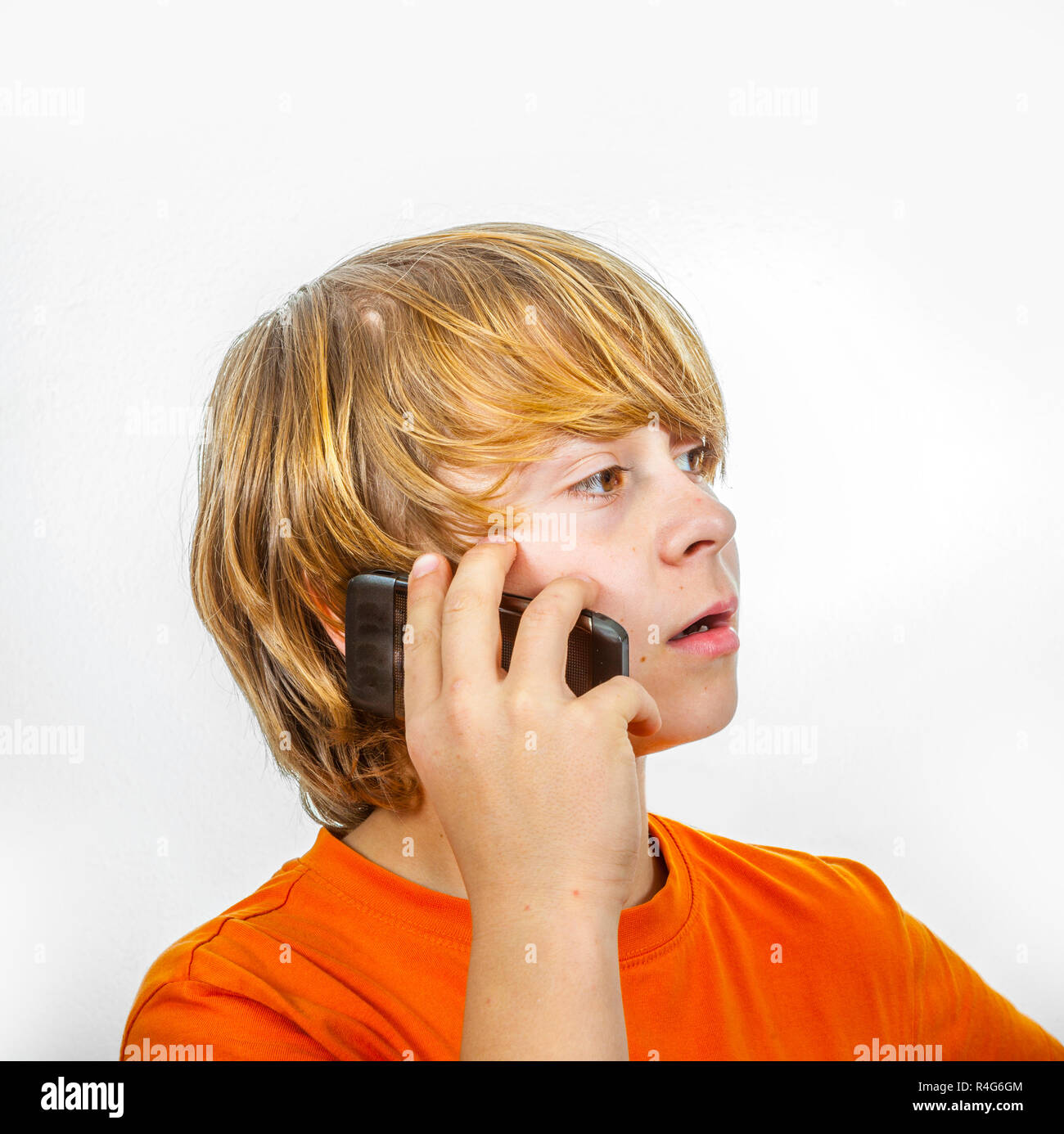 boy is using the mobile Stock Photo - Alamy