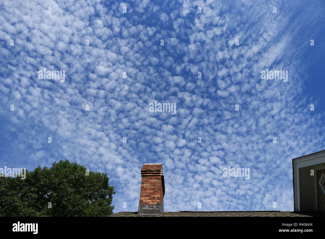 Landscape: Tree, Chimney, Roof, Blue Sky, Clouds Stock Photo - Alamy