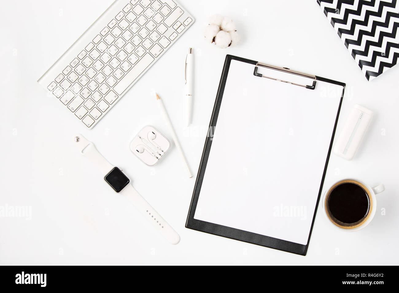 Top view of white office table with notebook Stock Photo - Alamy