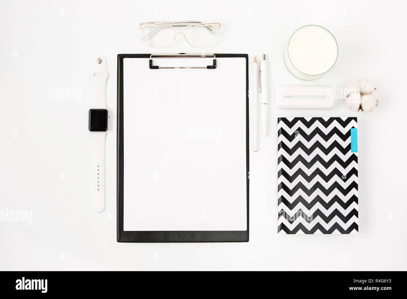 Top view of white office table with notebook Stock Photo - Alamy