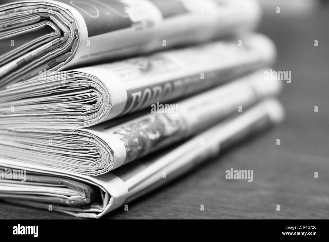 Stack of newspapers on table Black and White Stock Photos & Images - Alamy