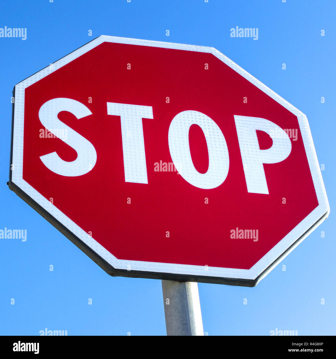 Stop sign and blue sky Stock Photo - Alamy