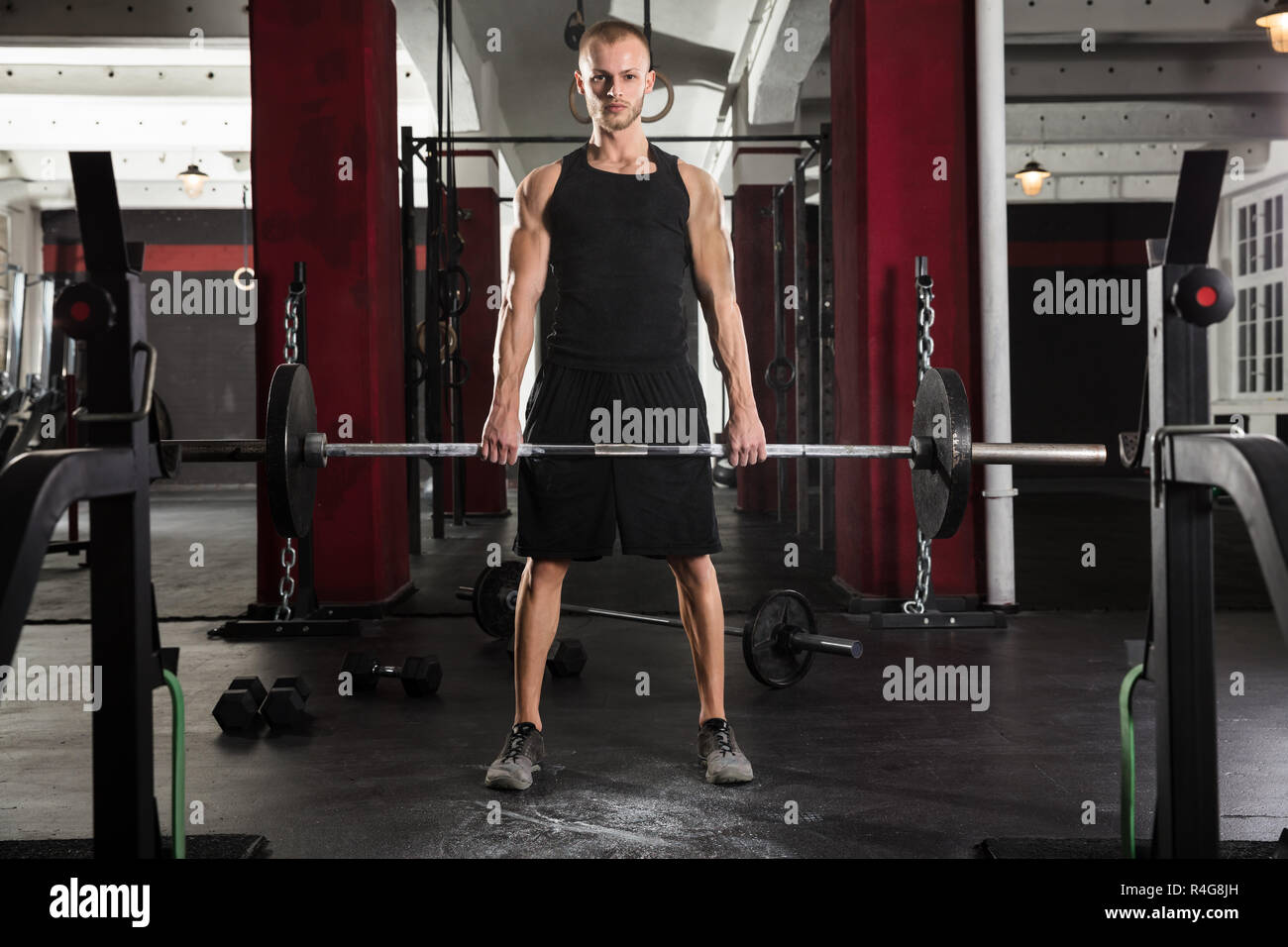 Young Man Lifting Barbell Stock Photo - Alamy