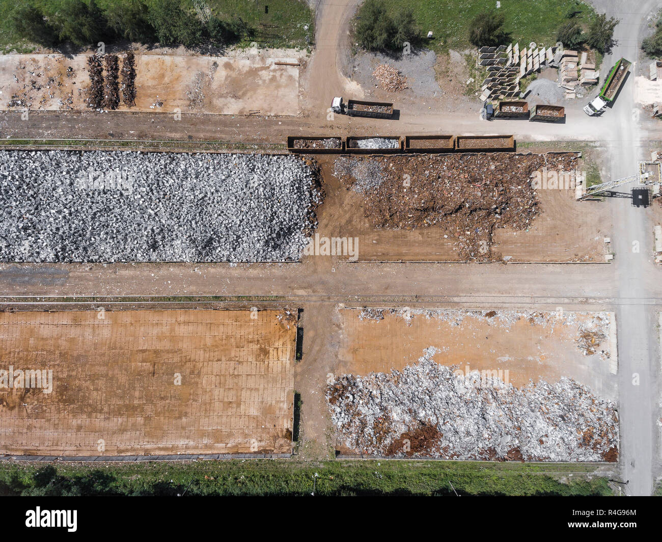 Iron raw materials recycling pile, work machines. Metal waste junkyard ...