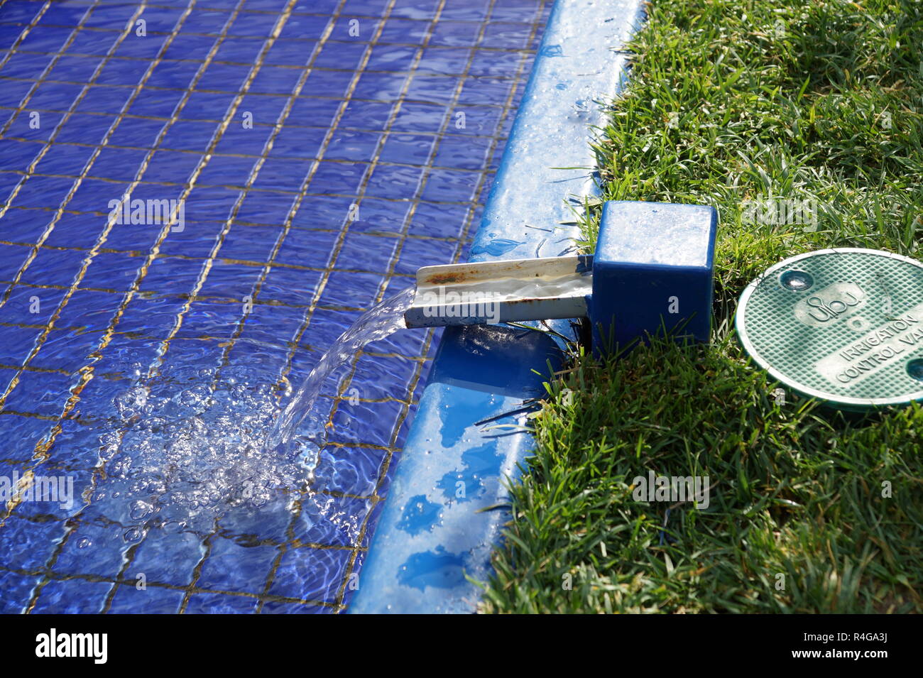 detail from open air swimming pool,steel tap with running water Stock ...