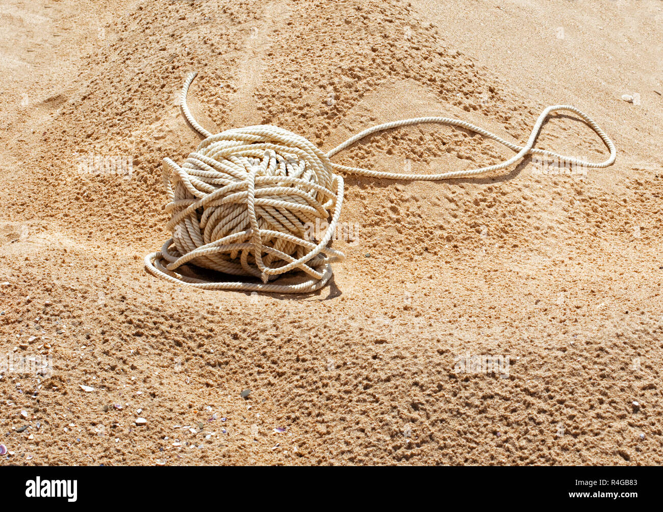 Fishing net lying on sand hi-res stock photography and images - Alamy