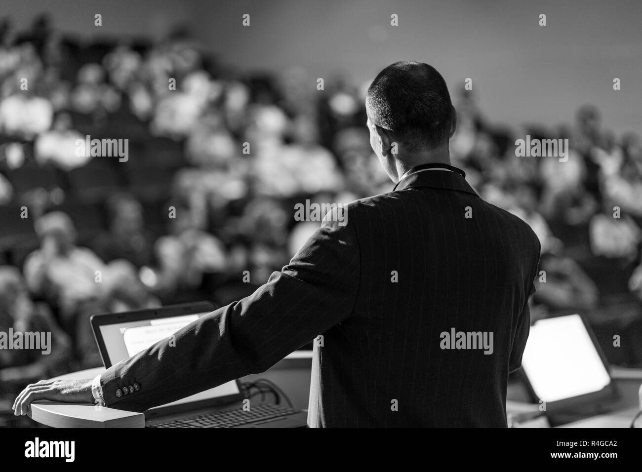 Public speaker giving talk at business event Stock Photo - Alamy