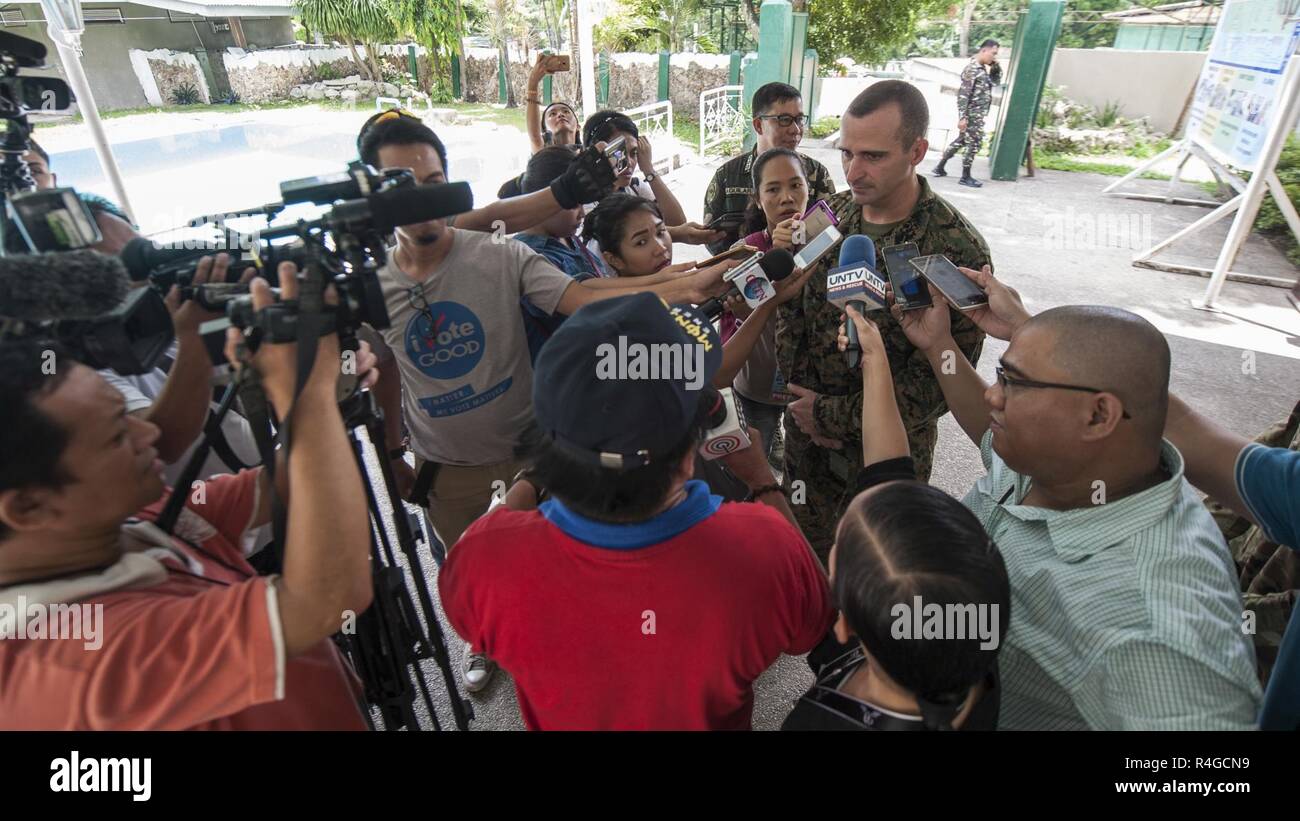 U.S. Marine Lt. Col. Ryan E. Scott answers questions from local media ...
