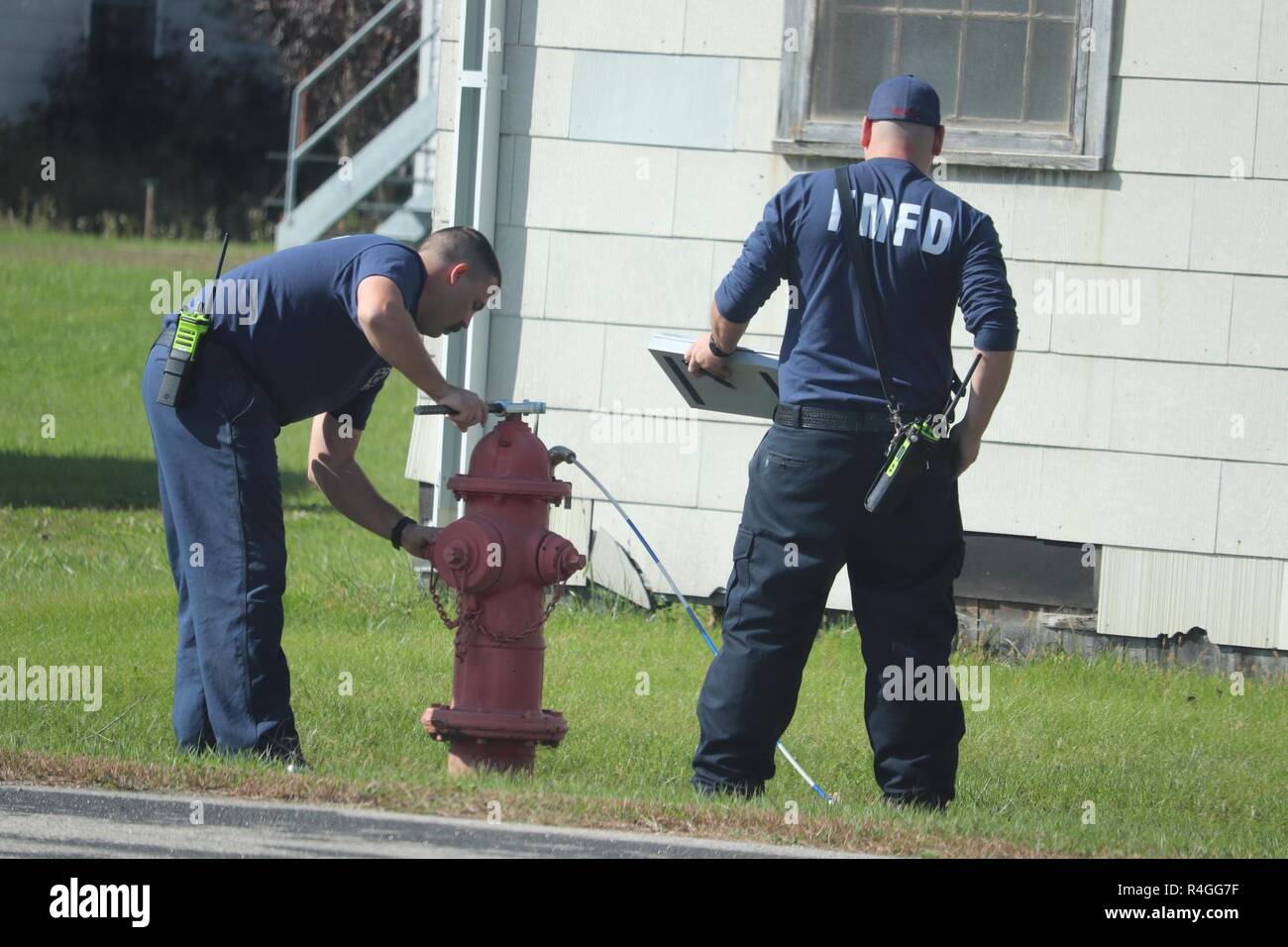 Firefighters with the Directorate of Emergency Services Fire Department ...