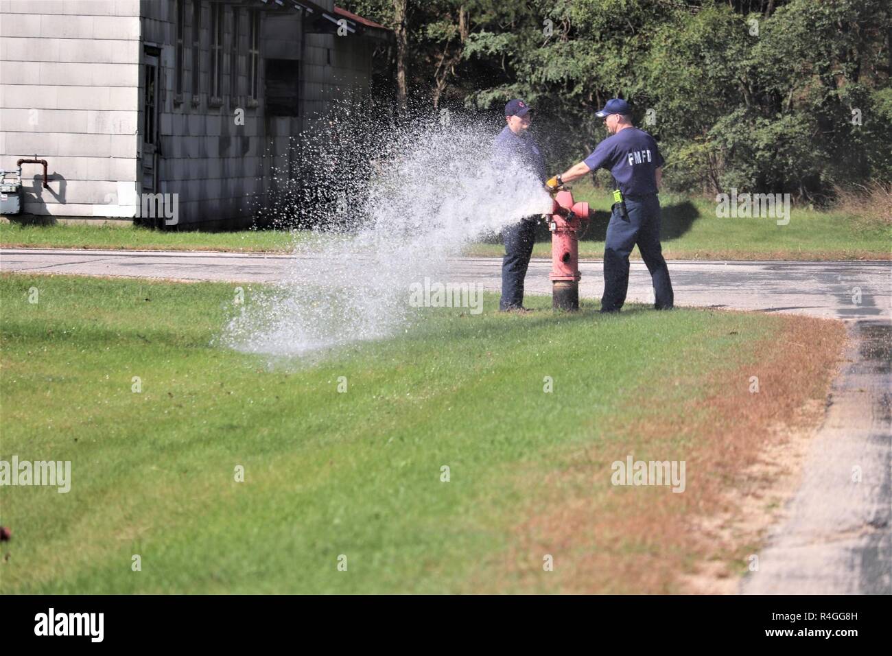 Firefighters with the Directorate of Emergency Services Fire Department ...